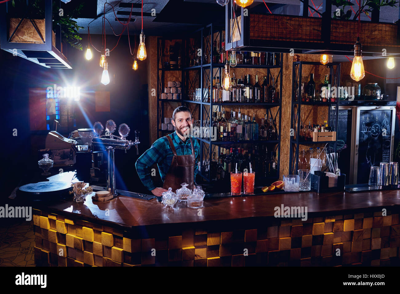 The barista bartender smiles at workplace in bar Stock Photo - Alamy