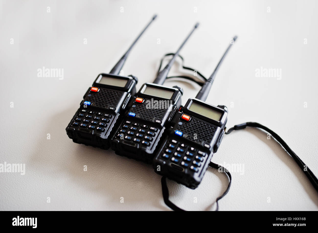 Three portable radio transmitter at steel background Stock Photo - Alamy