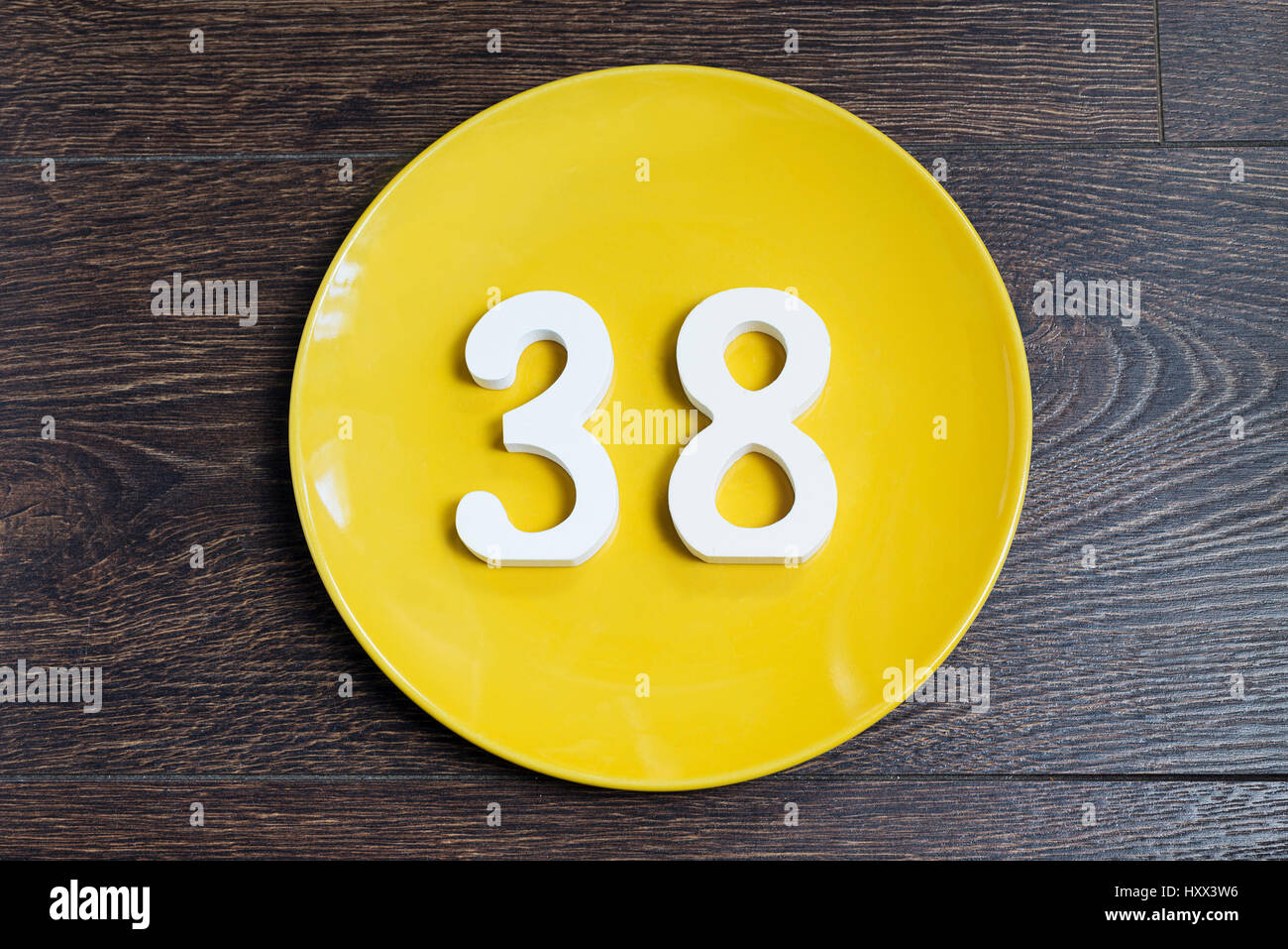 Figure thirty-eight at the plate yellow and brown background Stock ...