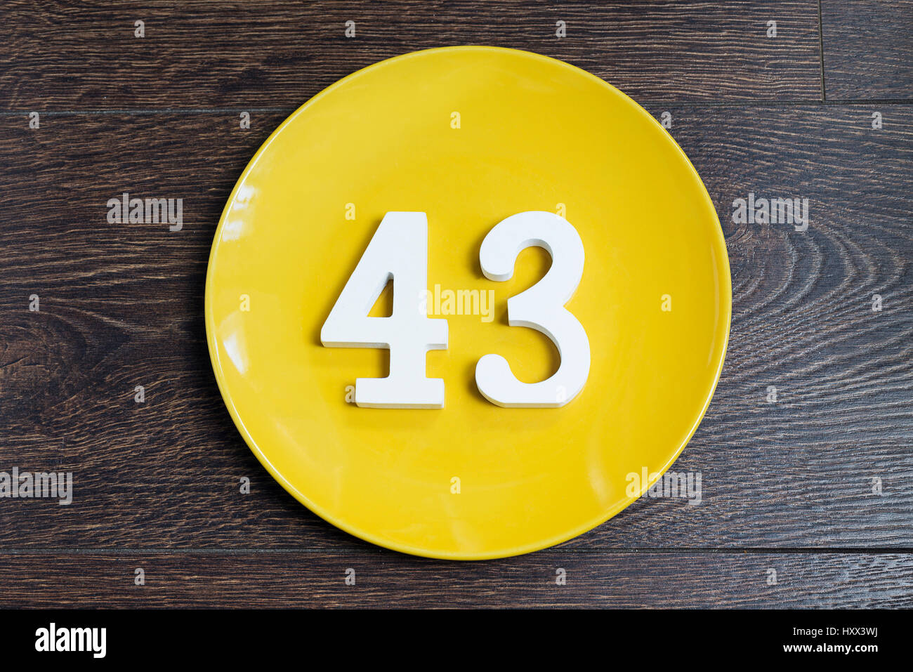 Number forty three on the plate yellow and brown background Stock Photo ...