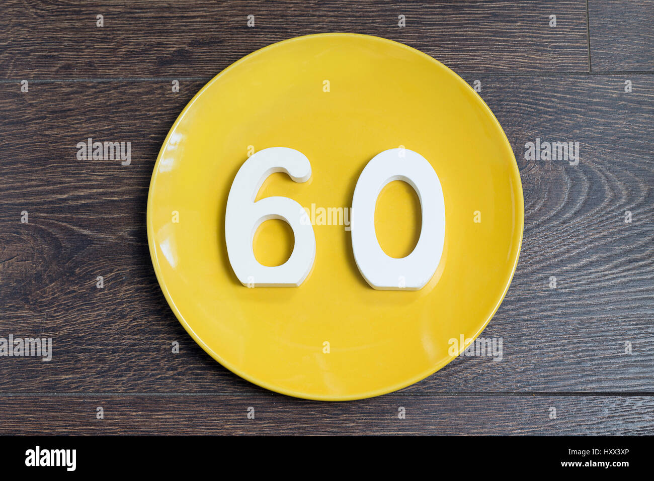 The number sixty on the plate yellow and brown background Stock Photo ...