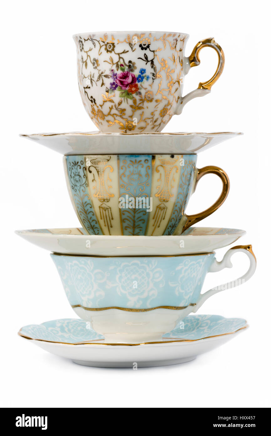 Decorated antique porcelain tea cups with saucers Stock Photo - Alamy