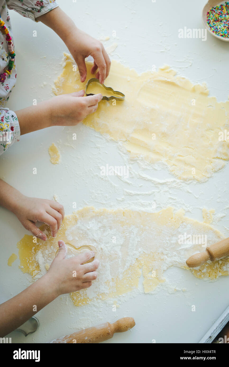 Two girls making cookies Stock Photo - Alamy