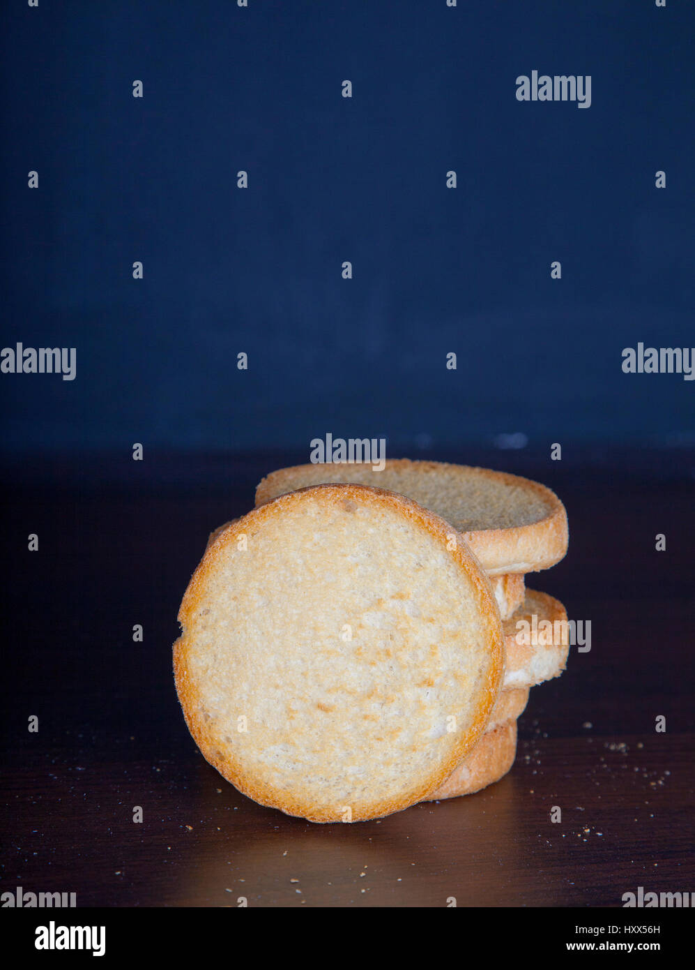 Pile of Dutch beschuit on black dark background Stock Photo - Alamy