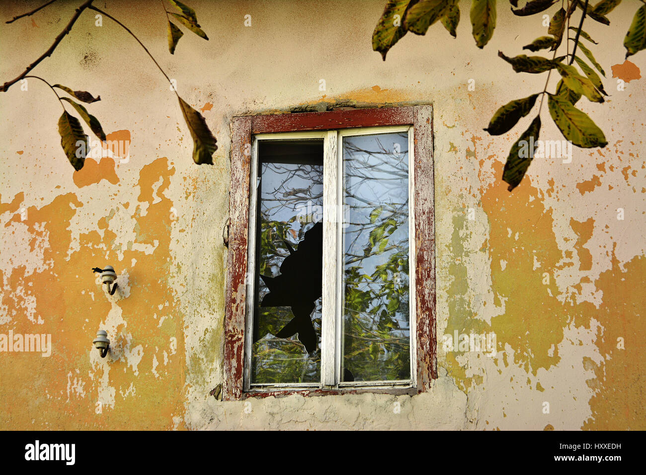 Abandoned building detail with broken window Stock Photo - Alamy