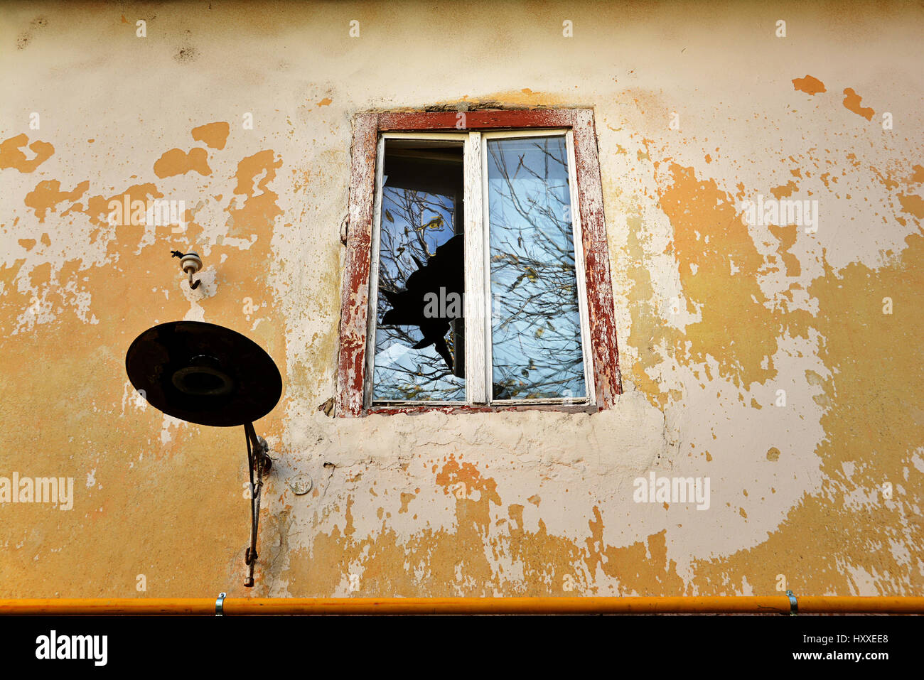 Abandoned building detail with broken window Stock Photo - Alamy
