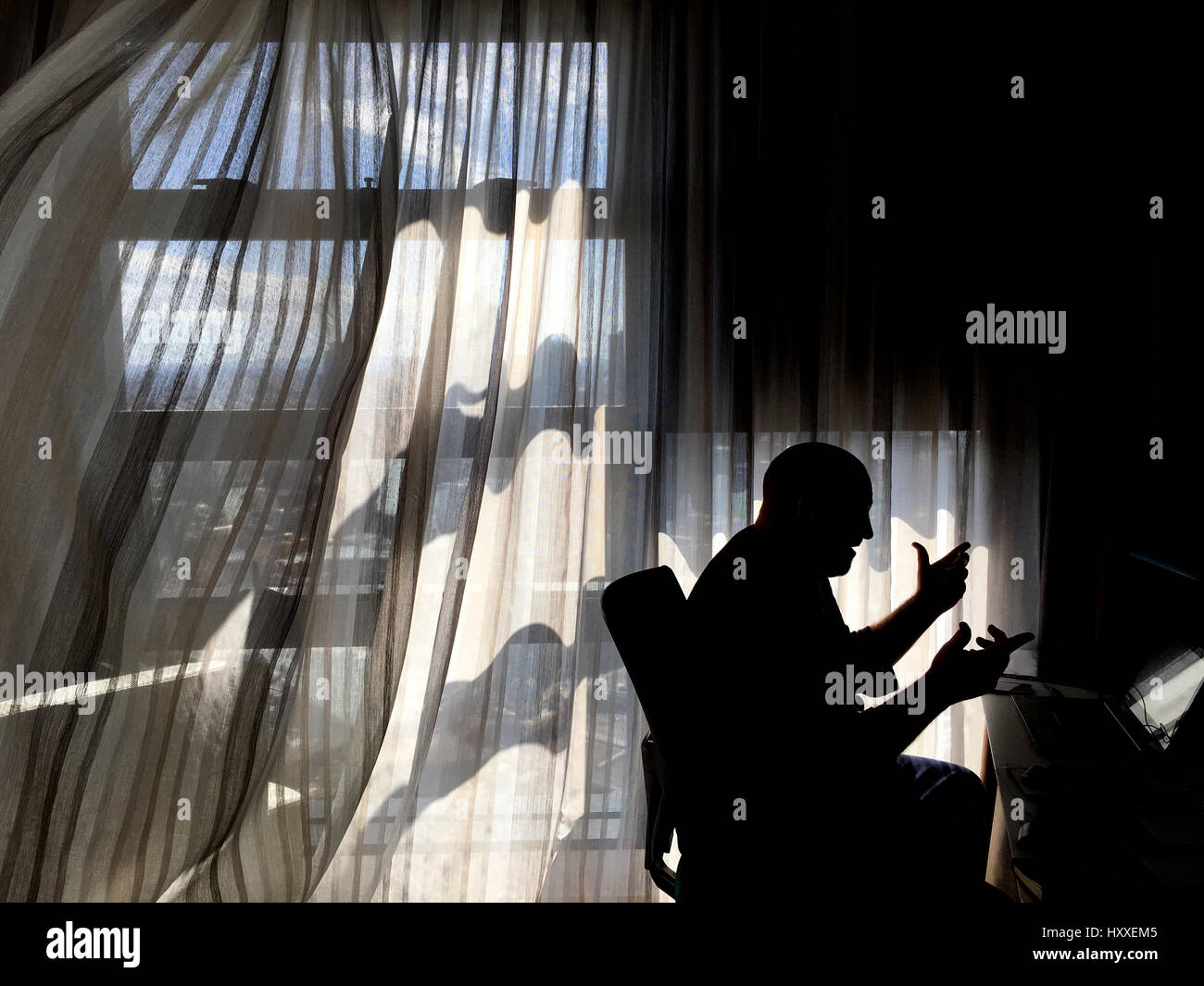 An animated man working in his home office Stock Photo - Alamy