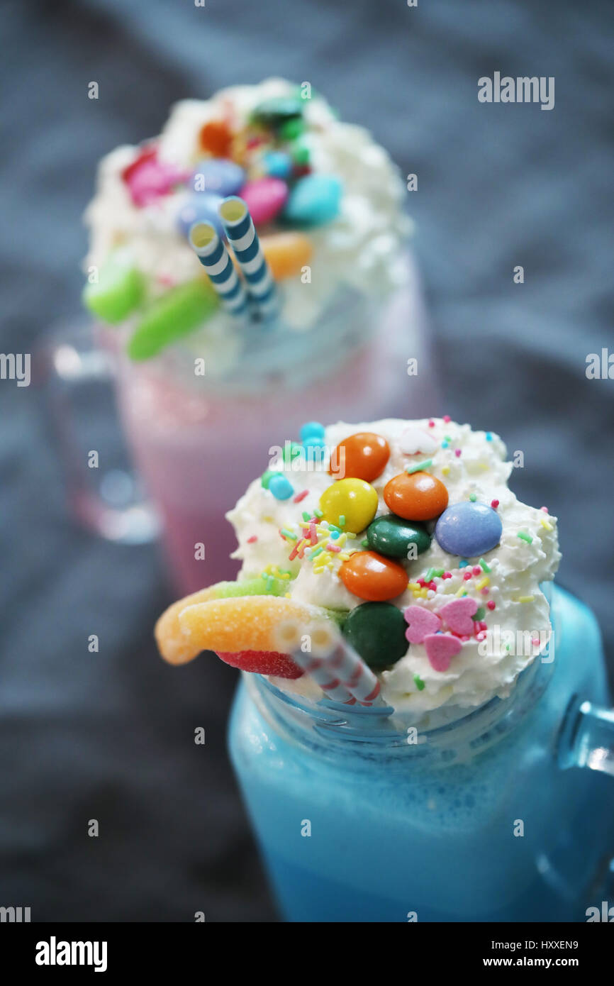 Glass pink milkshake decorated candy hi-res stock photography and ...