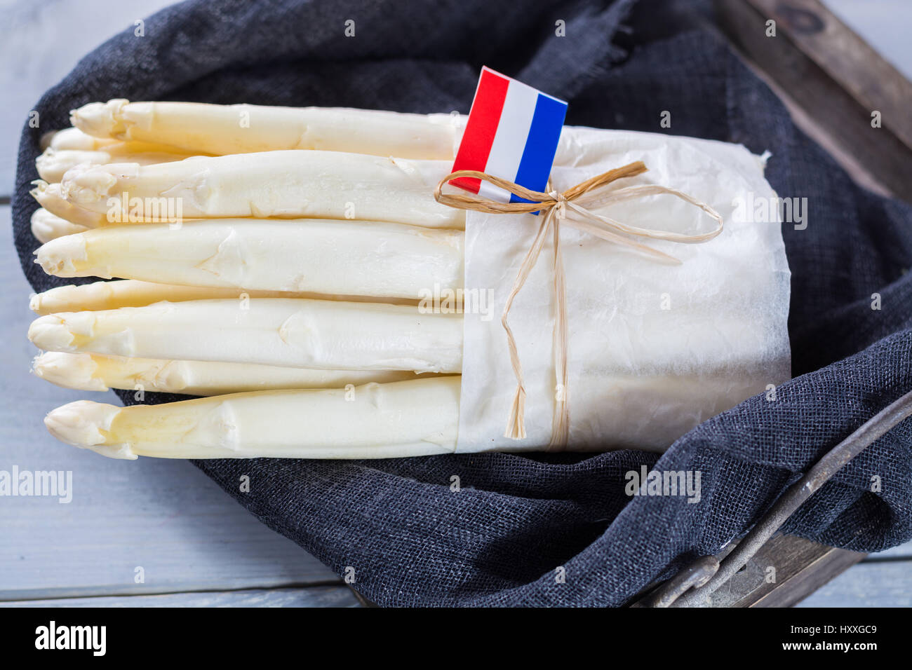 Fresh spring Dutch AA white asparagus, ready to cook, on wooden ...