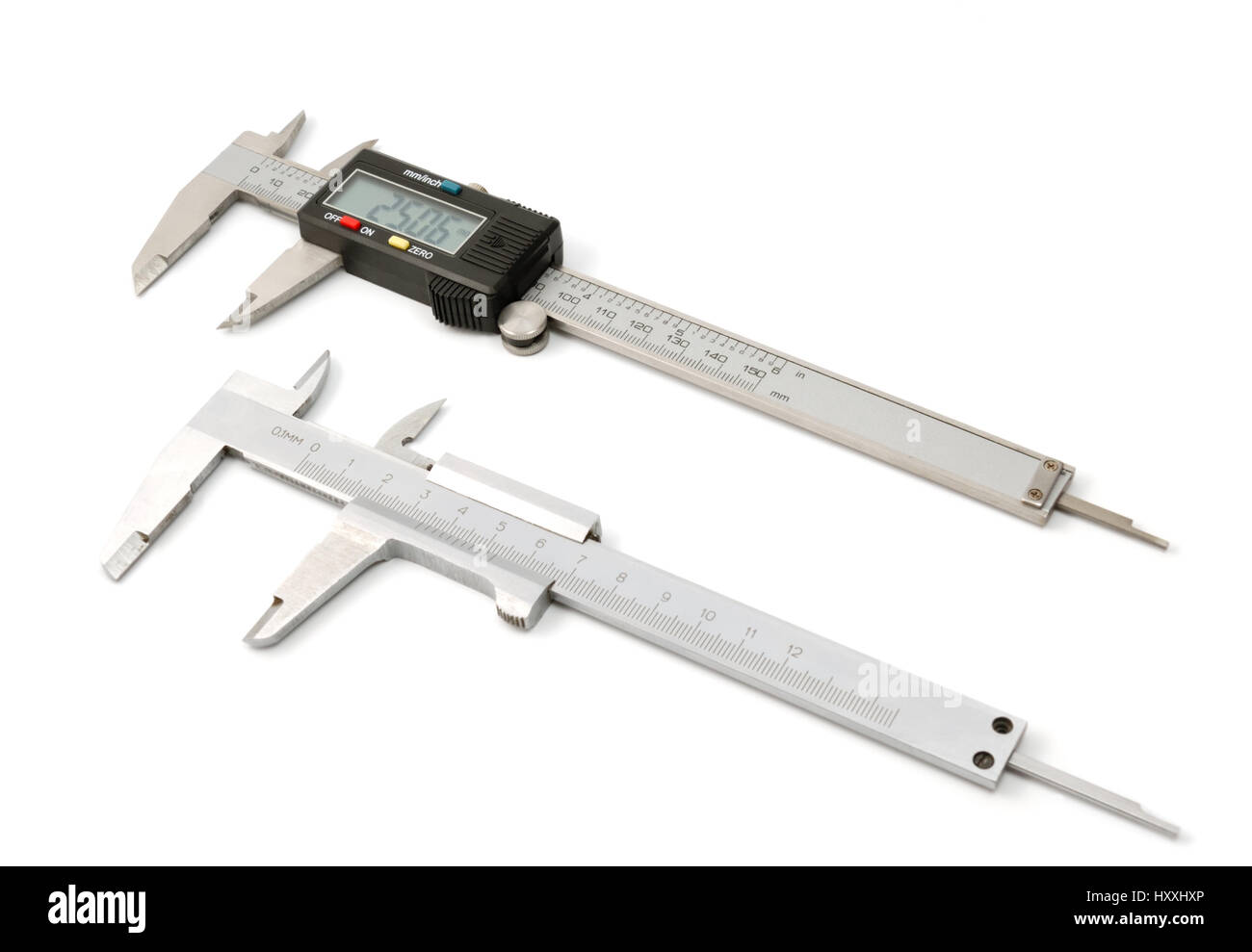 Tools collection - stainless steel and digital calipers on a white ...