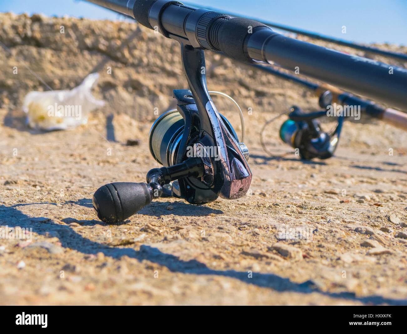 The coils on fishing rods on the seashore close-up Stock Photo - Alamy