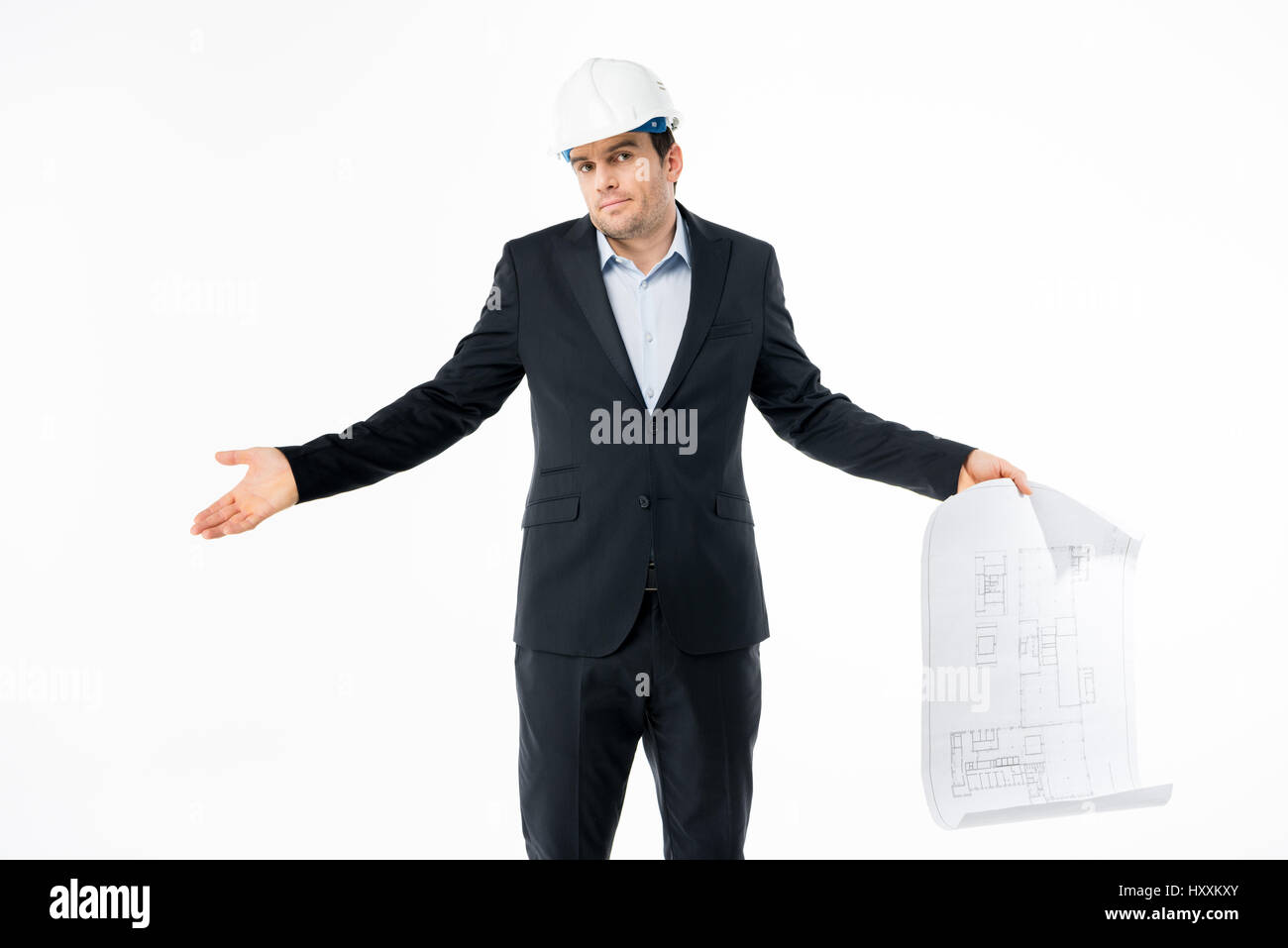 Confused male architect in hard hat holding blueprint on white Stock ...
