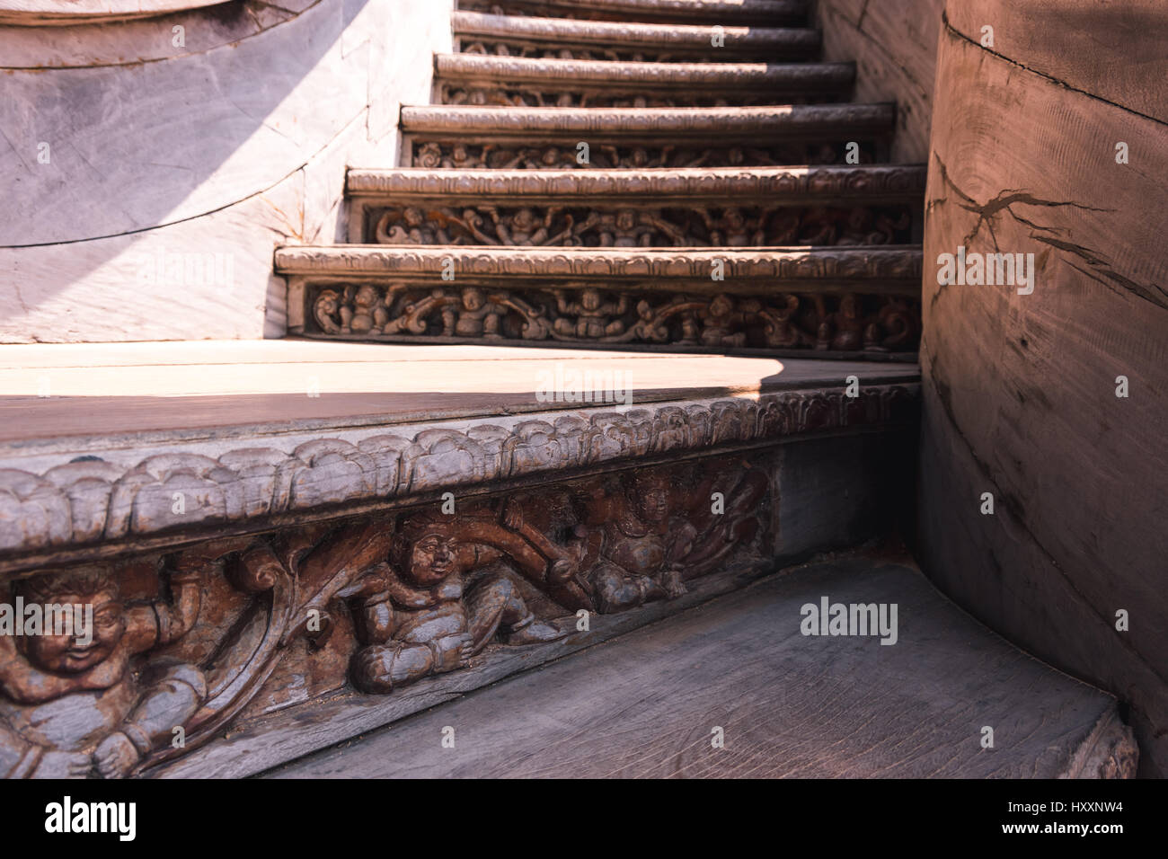 Intricately carved buddhist wooden stairs at the entrance of the ...
