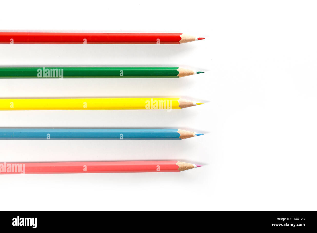Color pencils arrange in a row on white background Stock Photo - Alamy