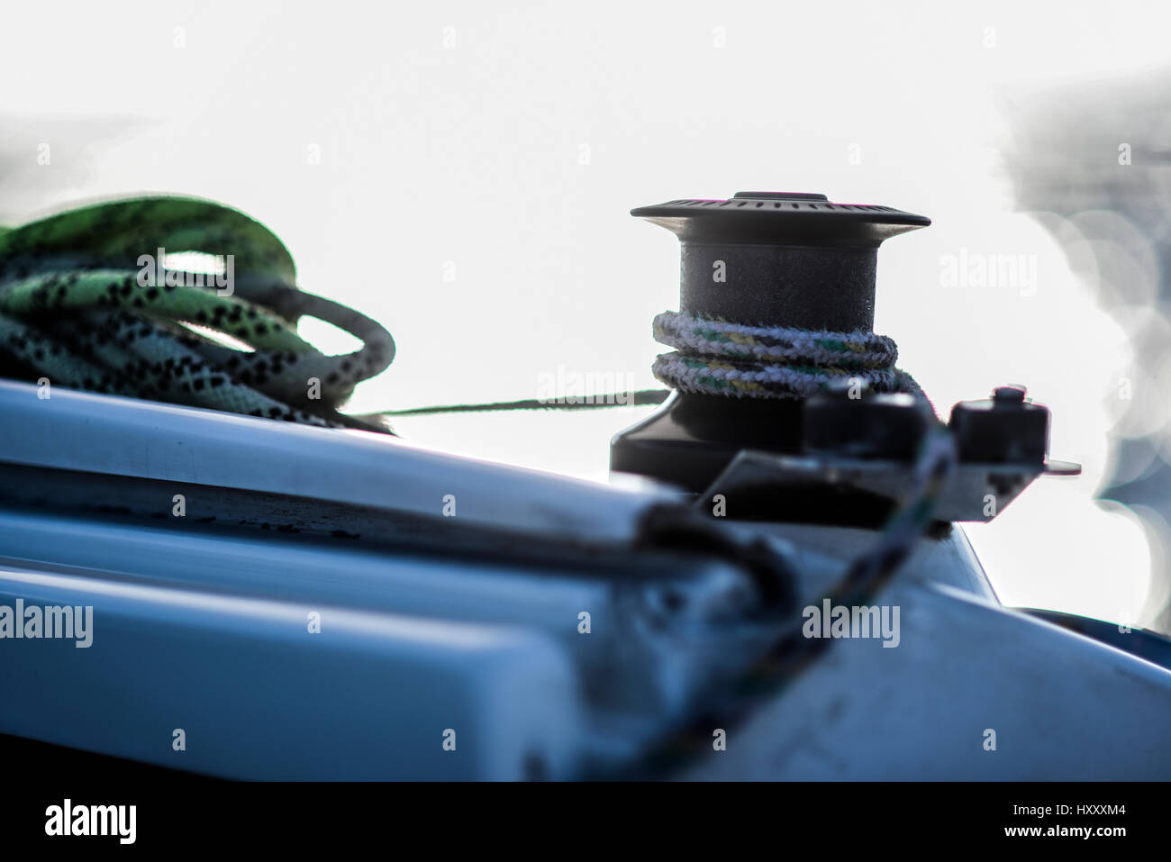 Capstan with line on a sailboat with white background Stock Photo - Alamy