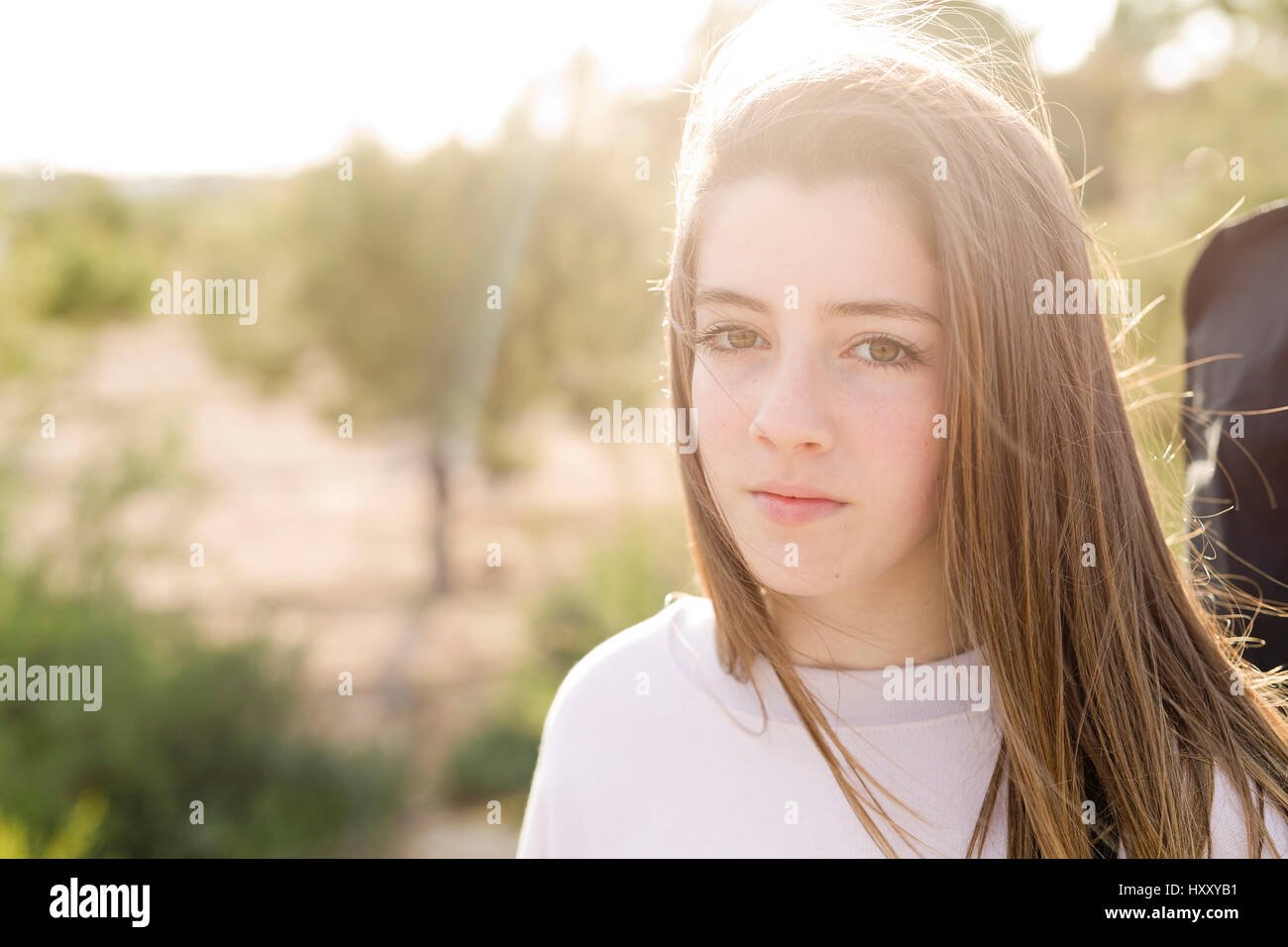 Portrait of a 15 year old teenage girl photographed in backlight Stock ...