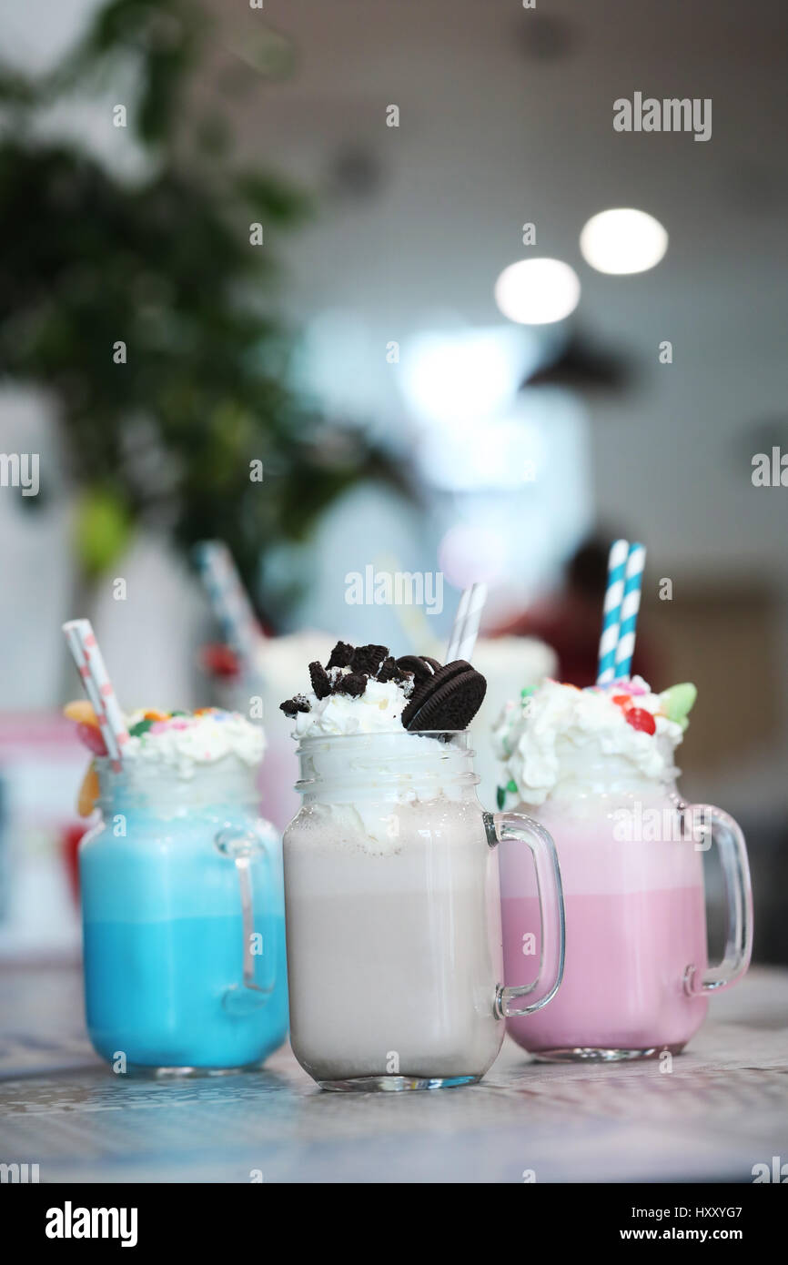 Glass pink milkshake decorated candy hi-res stock photography and ...