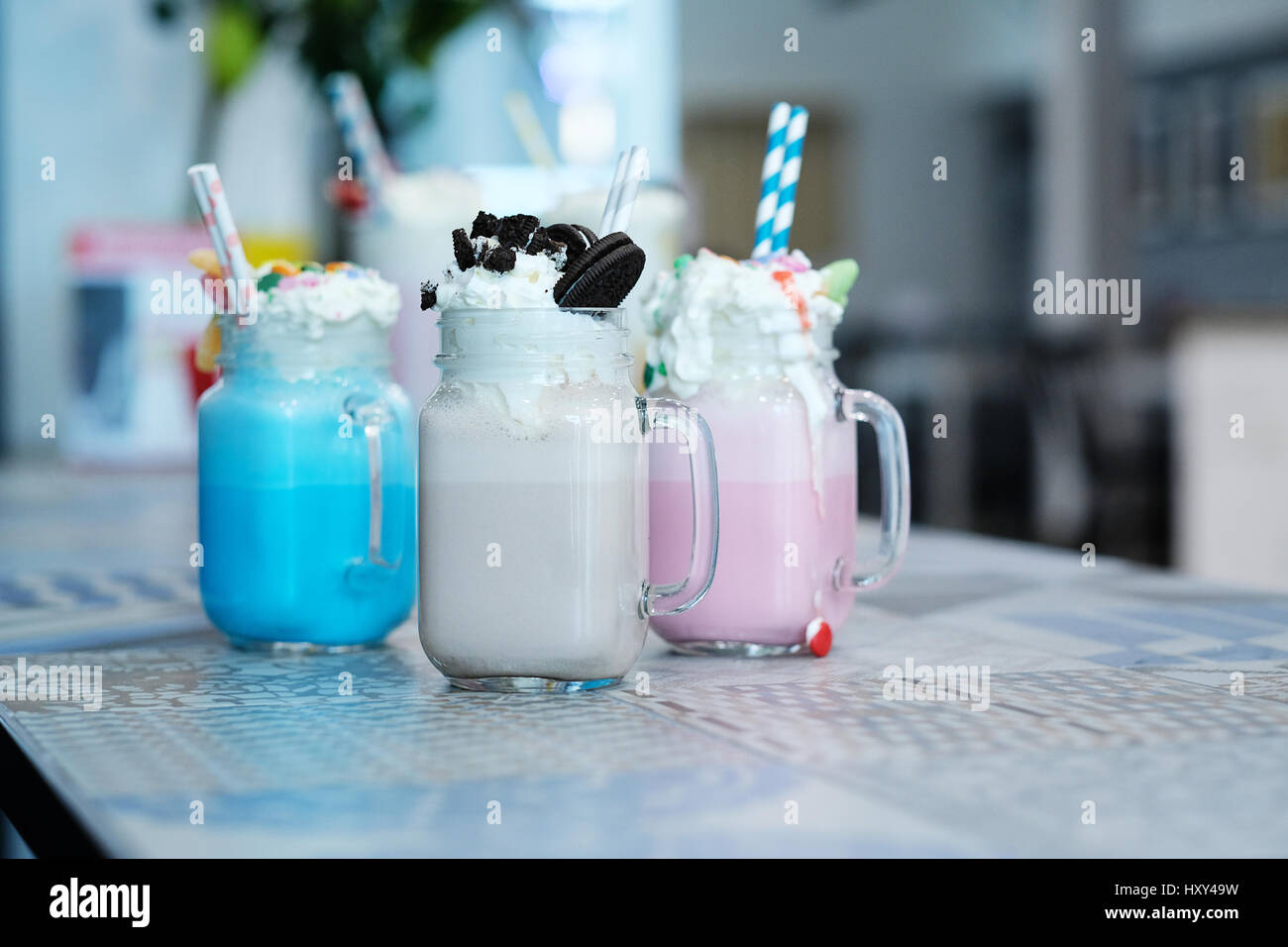 Glass pink milkshake decorated candy hi-res stock photography and ...
