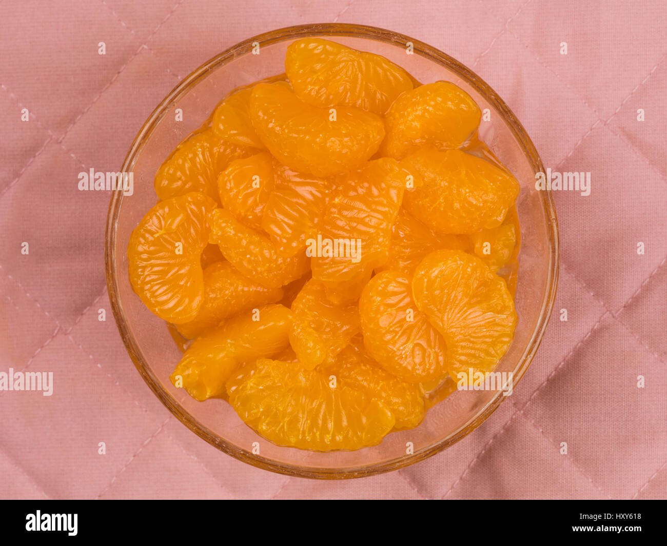Mandarin Orange Segments in a Bowl Against a Pink Background Stock ...