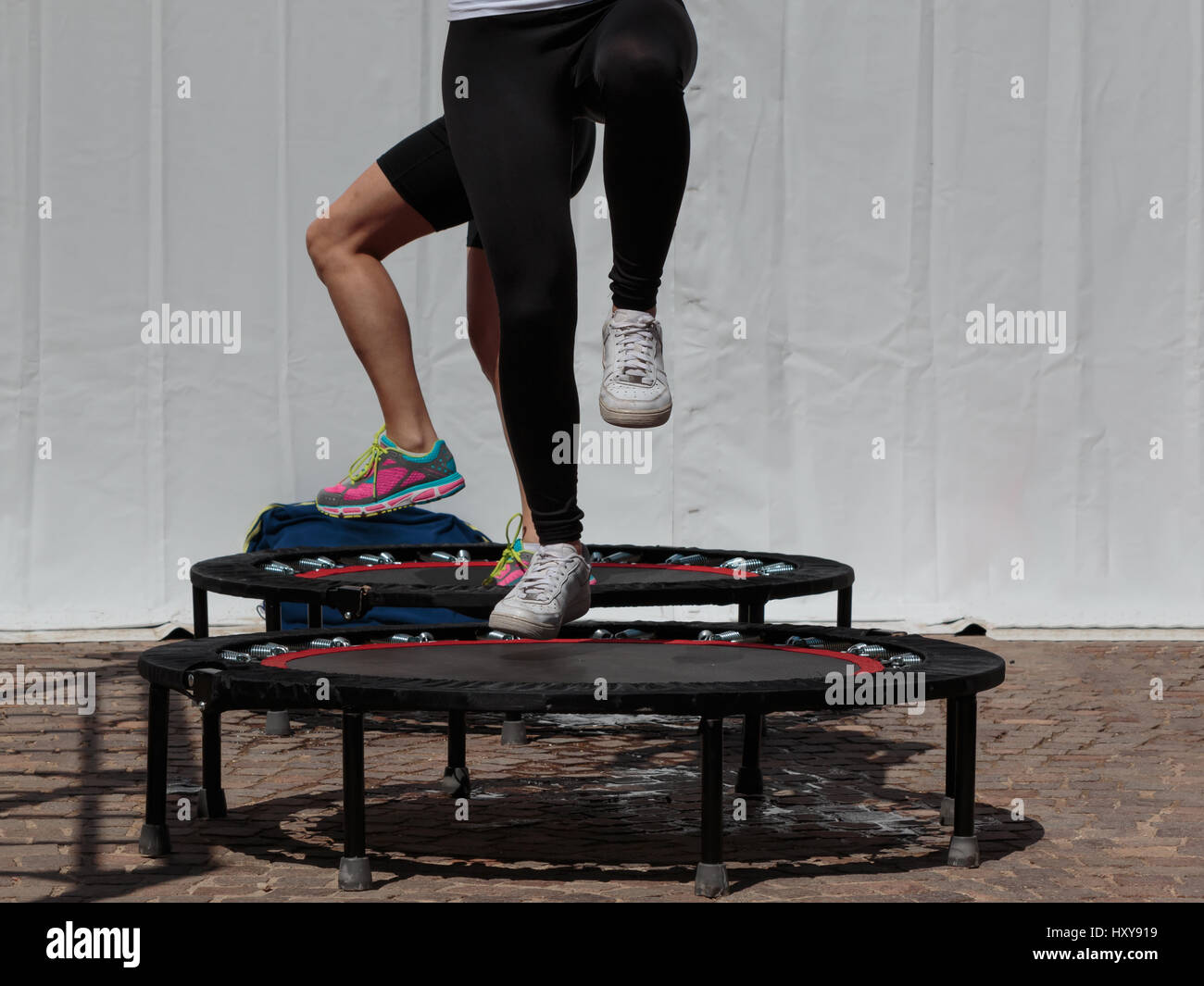 Mini Trampoline Workout: Girl doing Fitness Exercise in Class at Gym ...