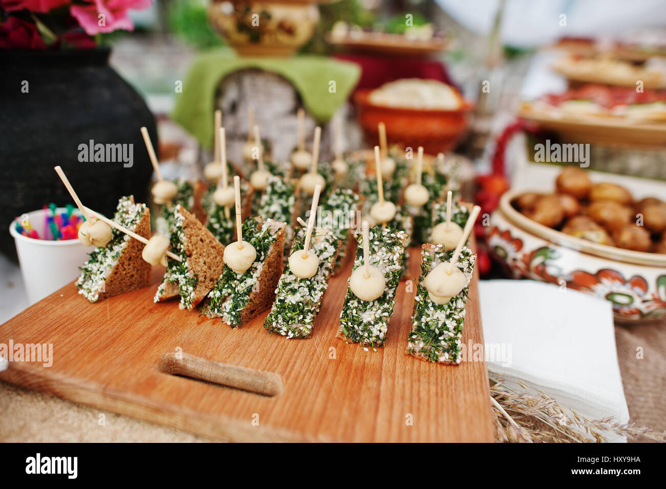 Brown bread canape with sesame, parsley and marinated mushrooms at ...
