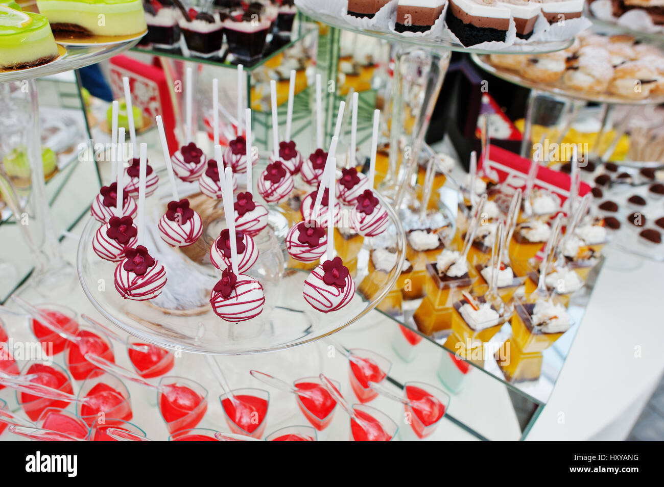 Wedding catering table with different sweets and cakes Stock Photo - Alamy