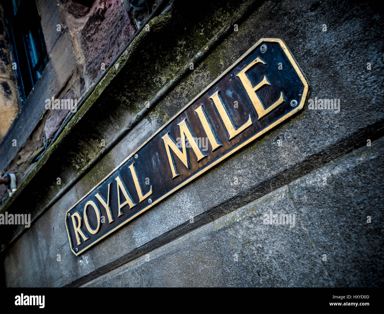 Closeup of a Royal Mile sign fixed to a pollution blackened building ...