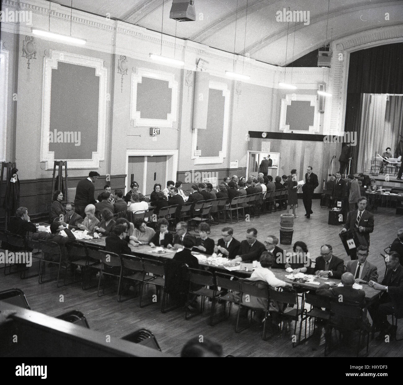 1960s, historical, men and women counting votes at a a counting centre ...