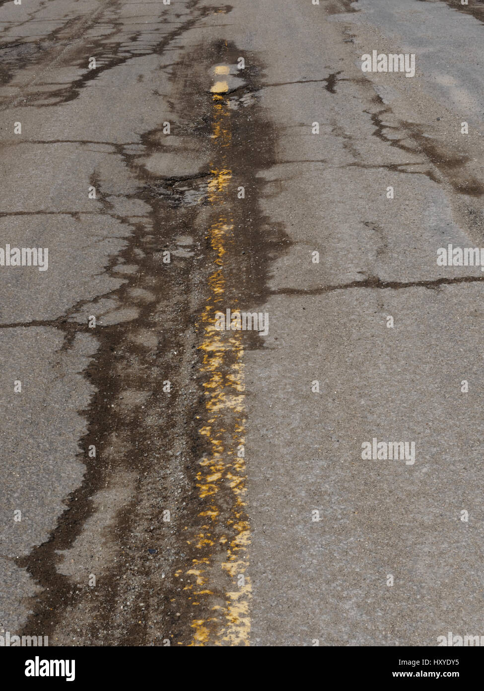 Asphalt road in poor condition Stock Photo - Alamy