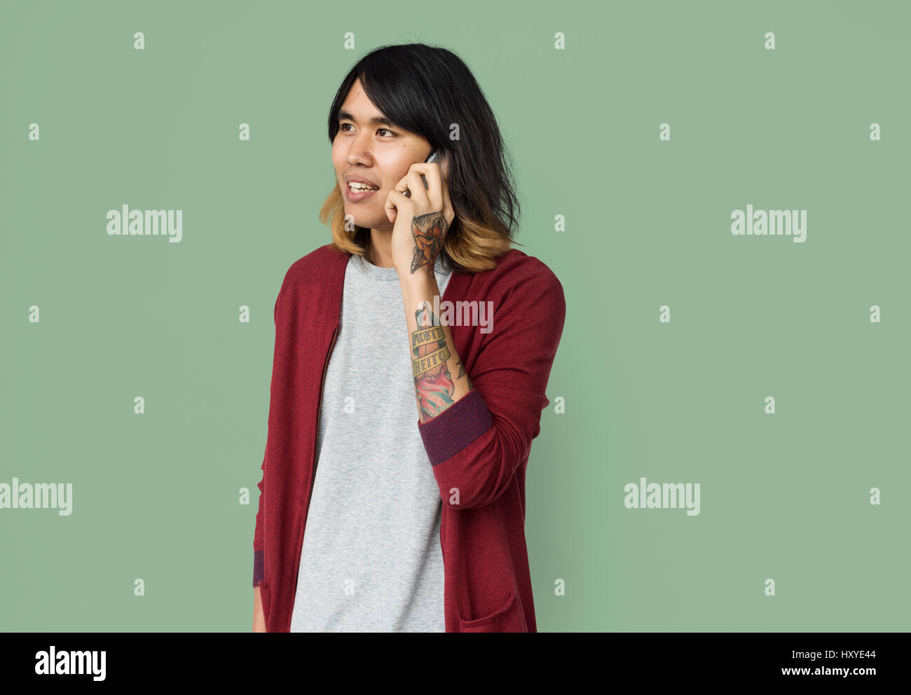 Asian guy talking on the phone portrait Stock Photo - Alamy