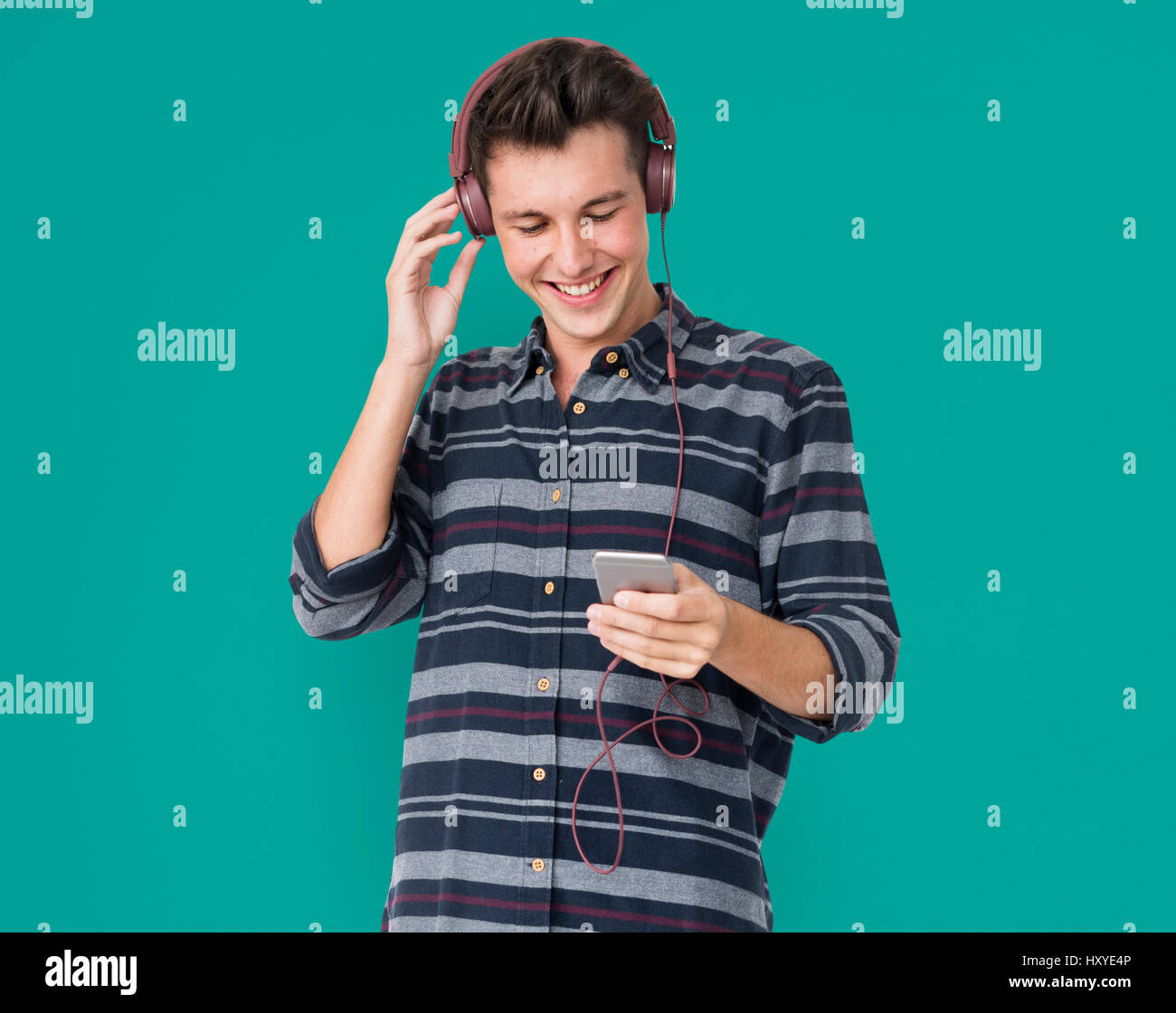 Young man casual listening to music Stock Photo - Alamy