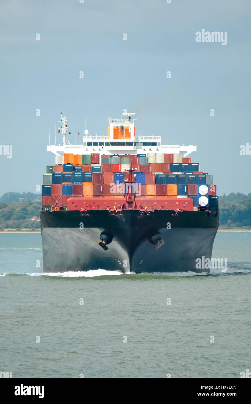 fully loaded container ship head-on in calm water Stock Photo - Alamy