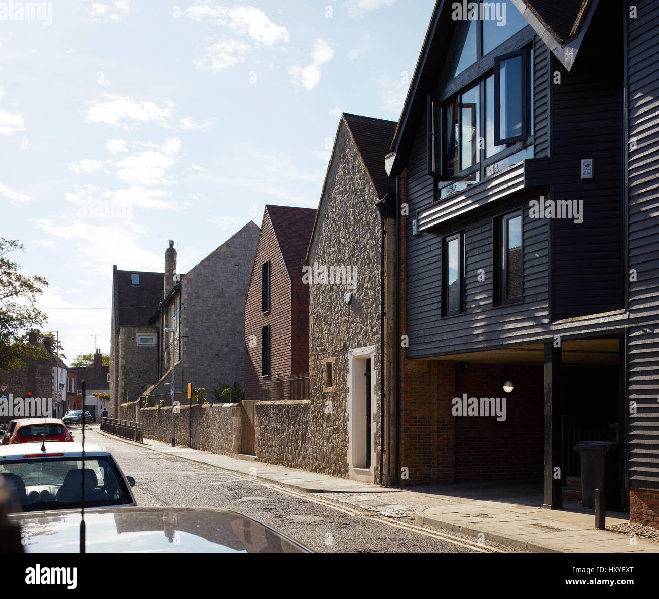 Street view along perimeter wall with old and new buildings. Kingsdown ...