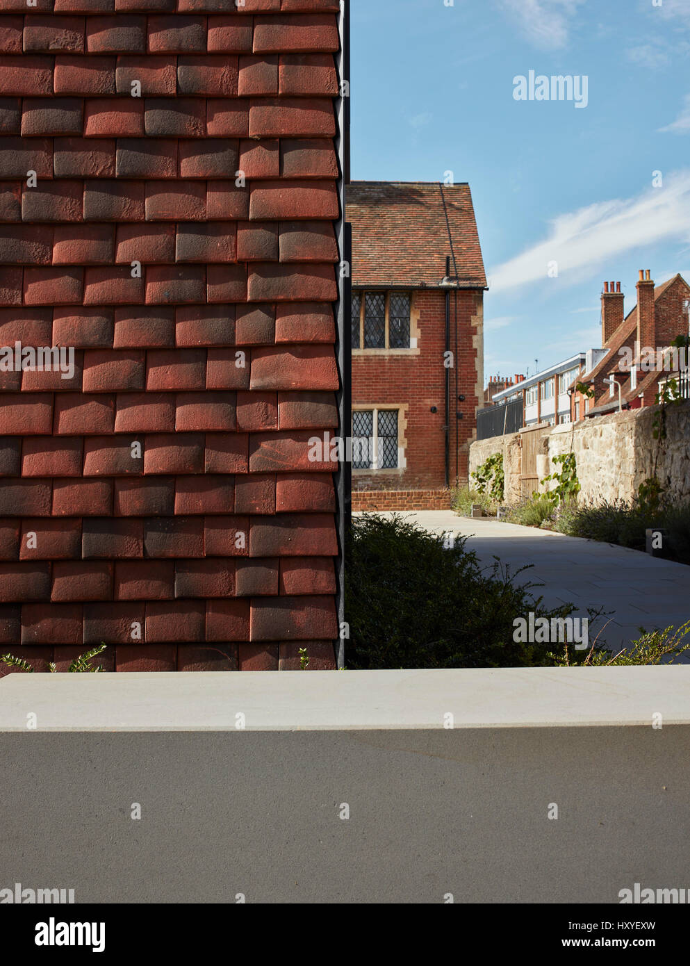 Exterior facade clad with handmade clay tiles. Kingsdown House, King's ...