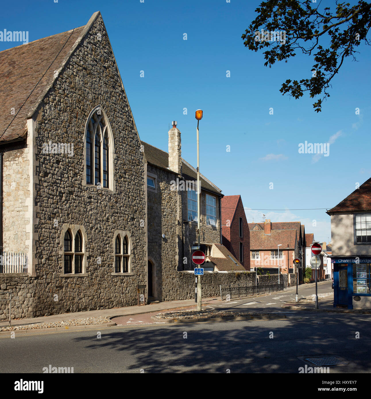 Street view along perimeter wall with old and new buildings. Kingsdown ...
