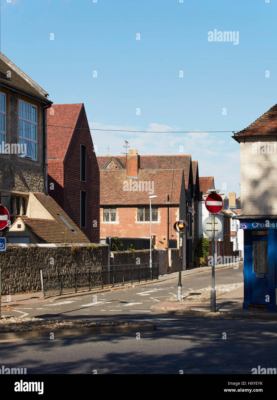 Street view along perimeter wall with old and new buildings. Kingsdown ...