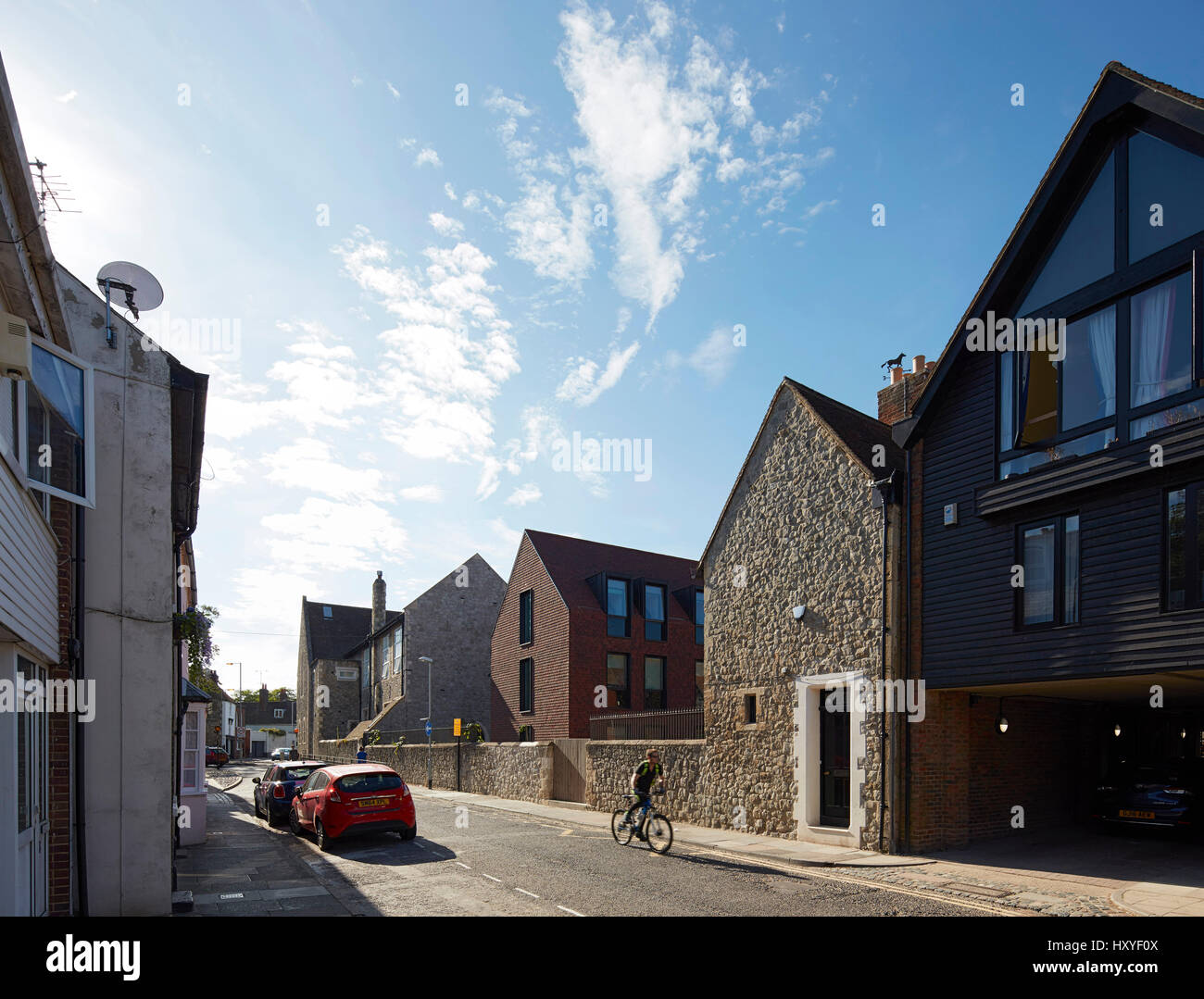 Street view along perimeter wall with old and new buildings. Kingsdown ...