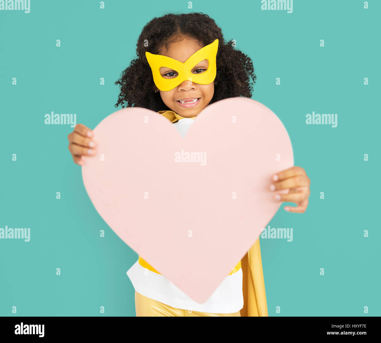 Superhero Kid Carrying Heart Concept Stock Photo - Alamy