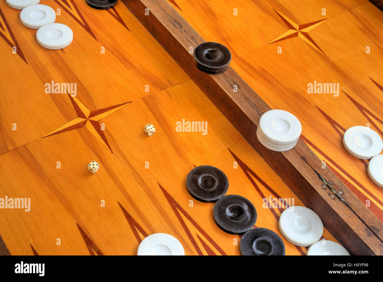 Wooden board for playing backgammon game with pools and dice Stock ...