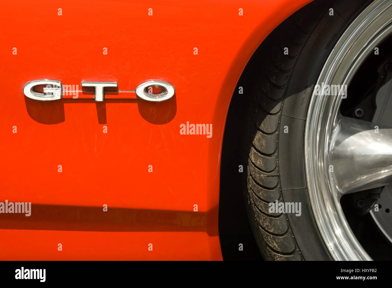 generic GTO badge and wheel on a classic vehicle Stock Photo - Alamy