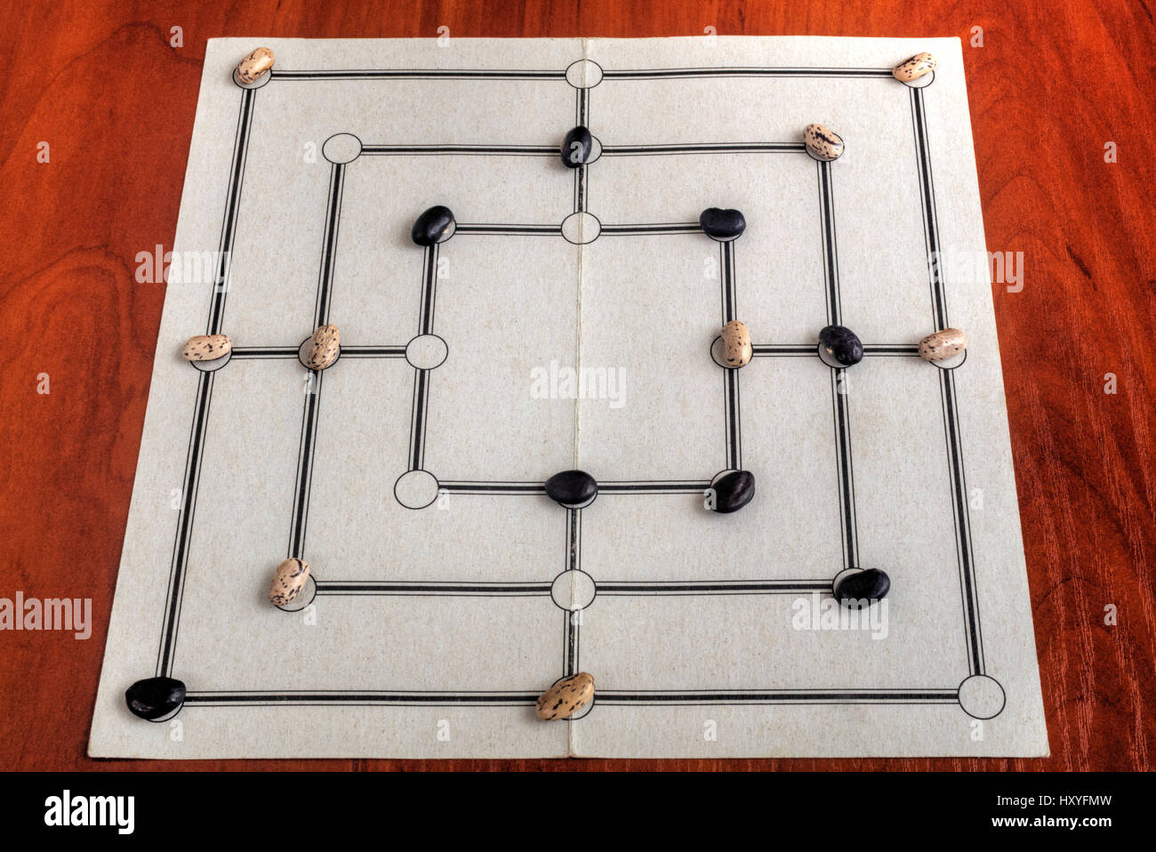Traditional board for playing Nine Men's Morris game Stock Photo - Alamy