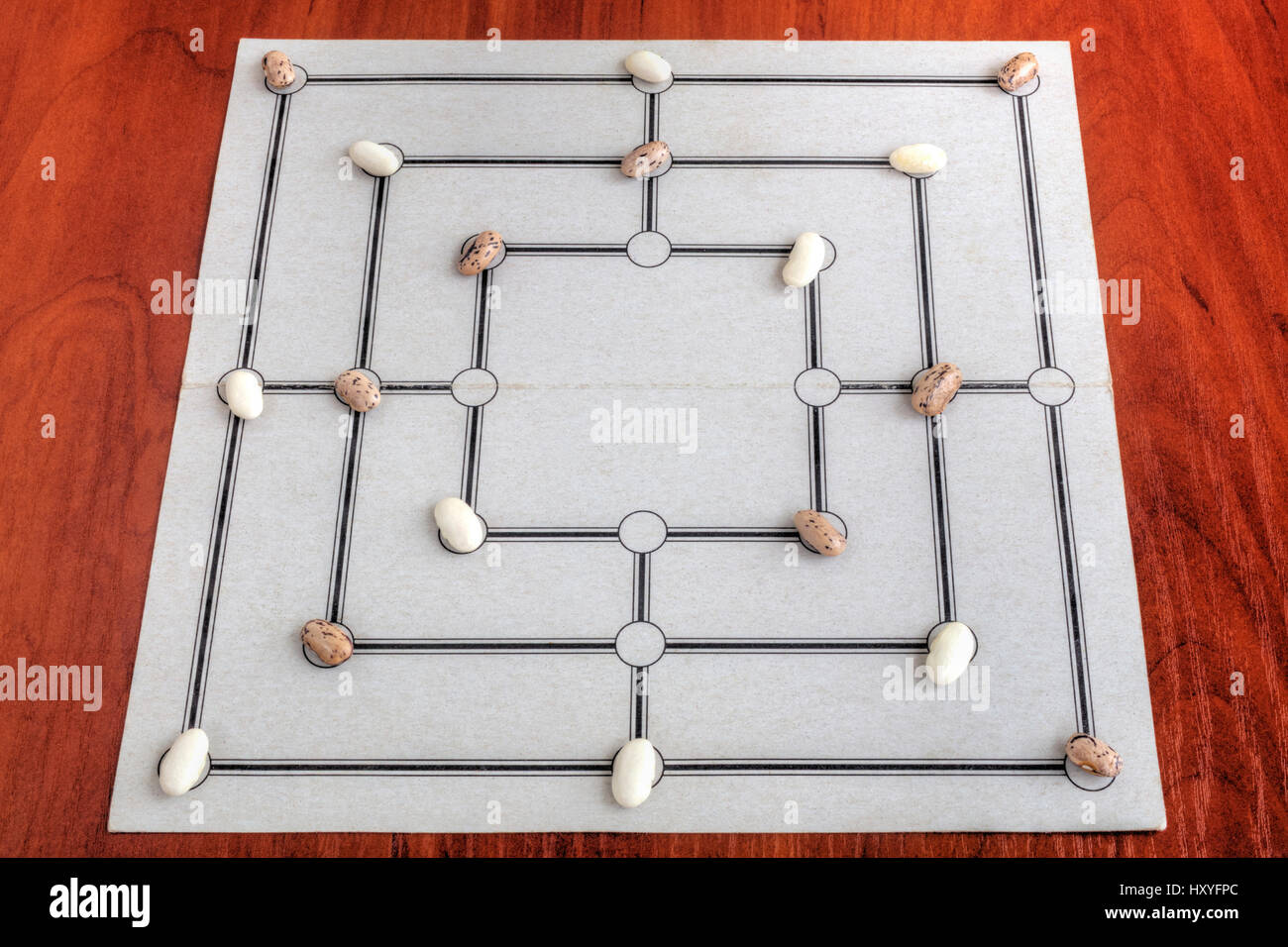 Traditional board for playing Nine Men's Morris game Stock Photo - Alamy