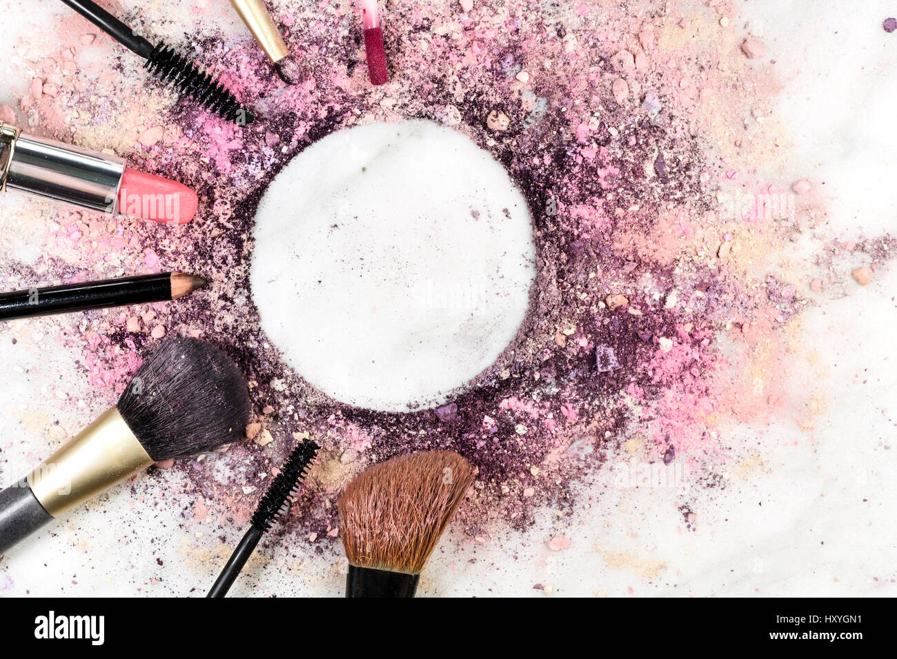 Makeup brushes, pencil, lipstick and other objects, forming a frame on ...