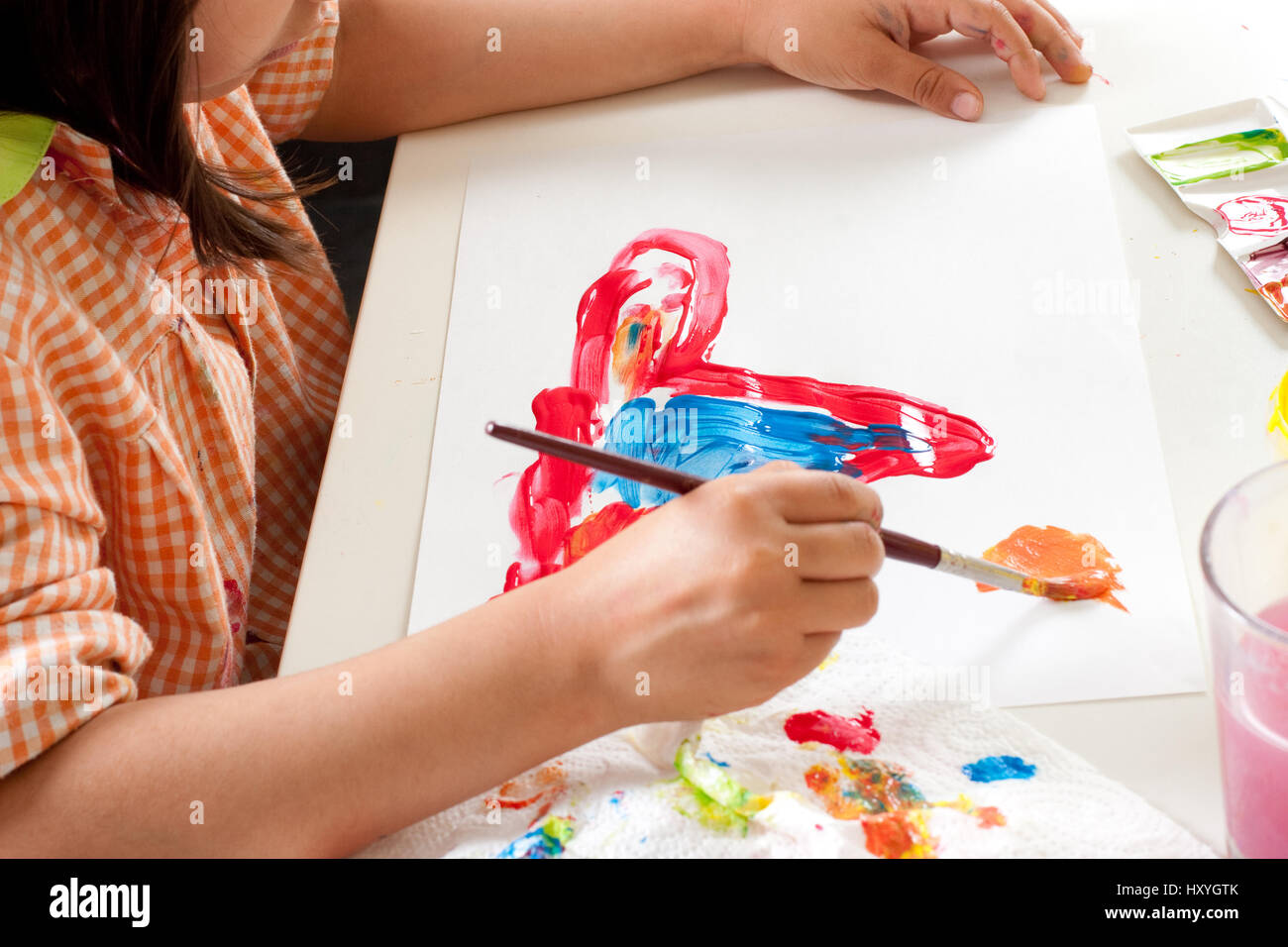 Hands of child painting with paintbrush Stock Photo - Alamy