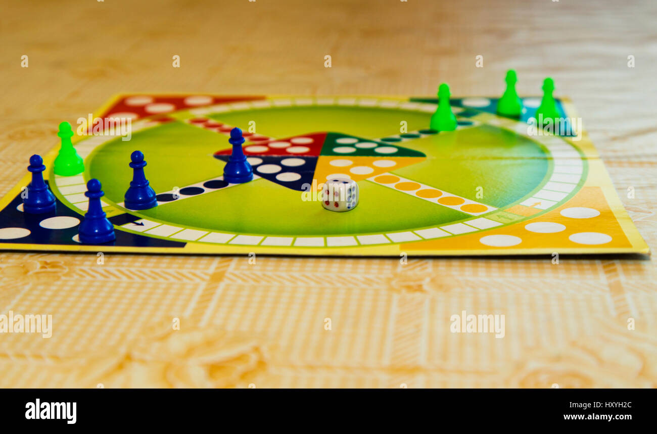 Colorful board for playing traditional children's game closeup Stock ...