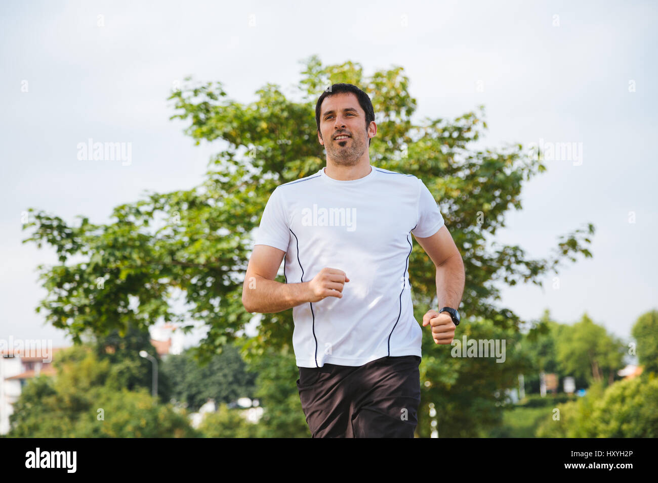 Happy running man outdoors Stock Photo - Alamy