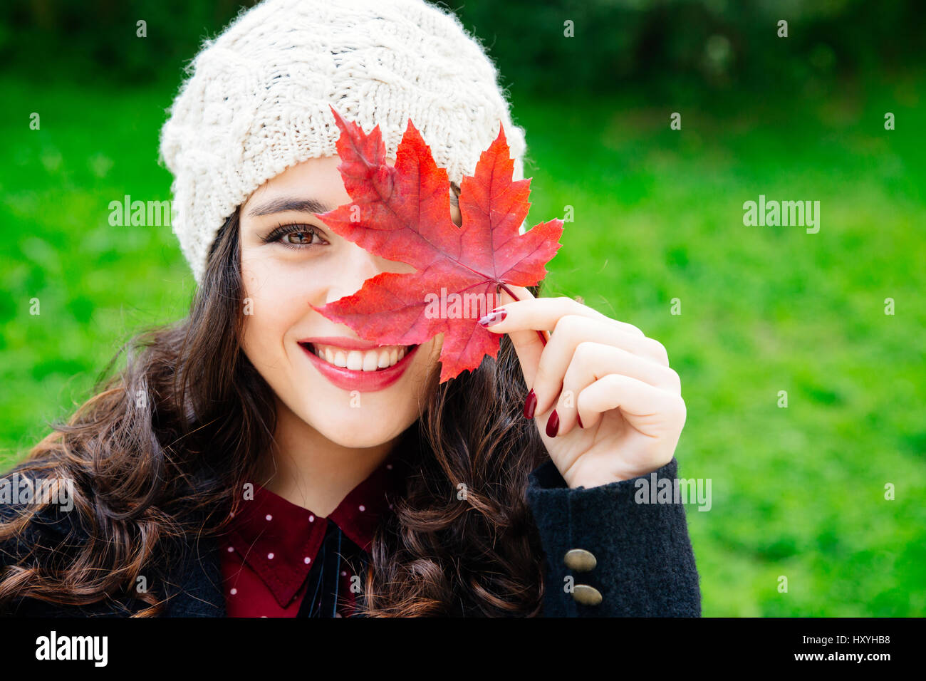 Young woman covering eye leaf hi-res stock photography and images - Alamy