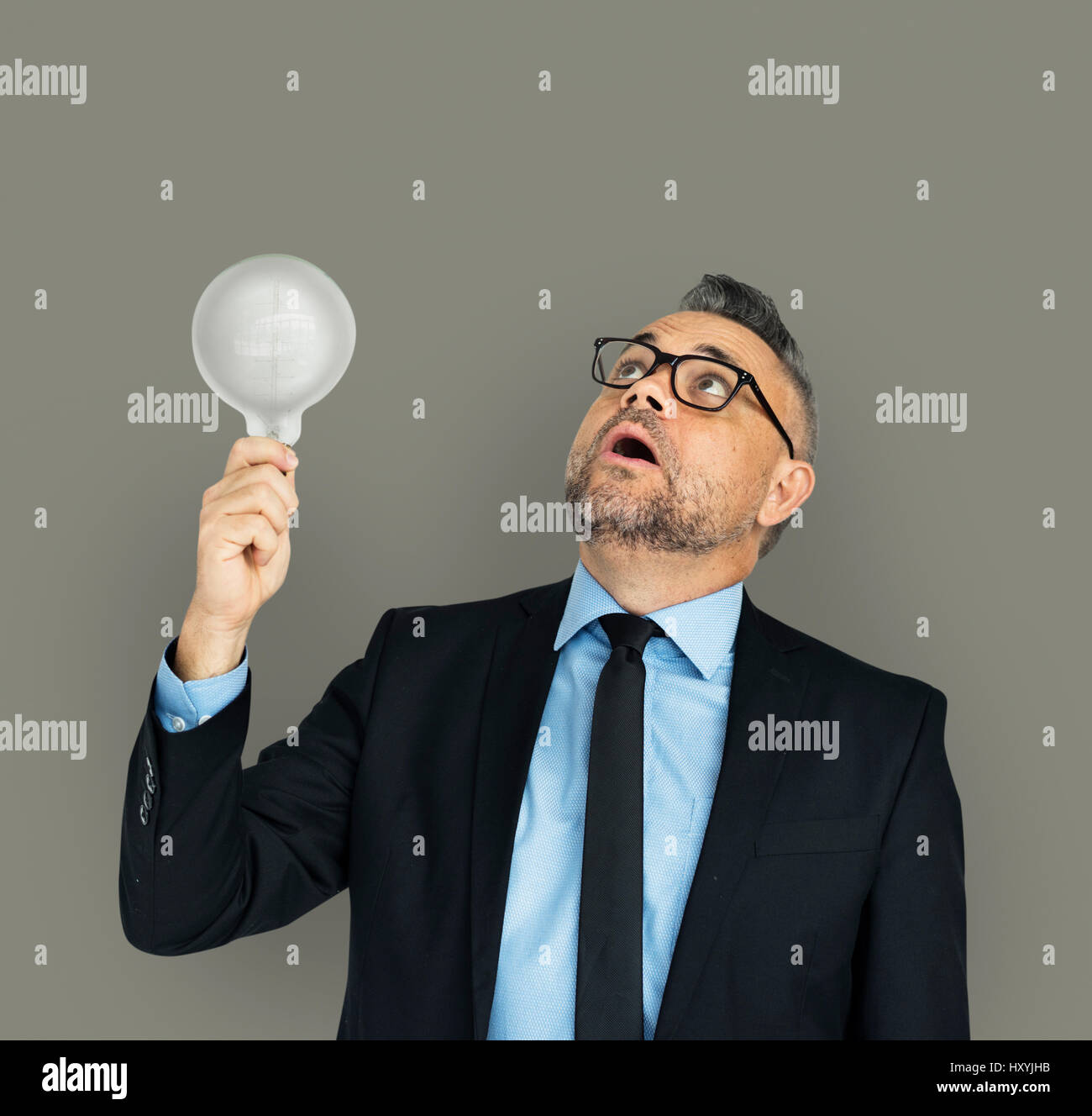 Caucasian Business Man Lightbulb Stock Photo - Alamy