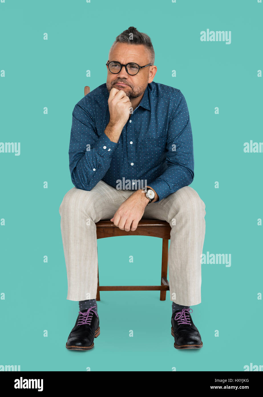 Caucasian Business Man Sitting Thinking Stock Photo - Alamy