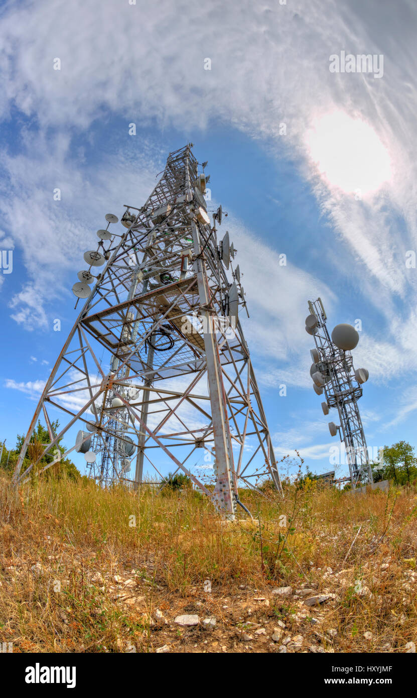 Communication antenna towers in fish-eye perspective Stock Photo - Alamy